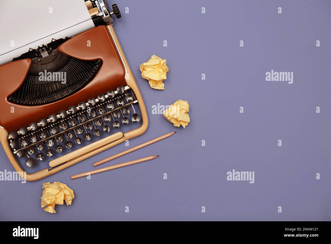 Vintage typewriter, pencils and crumpled paper on grey background, flat ...