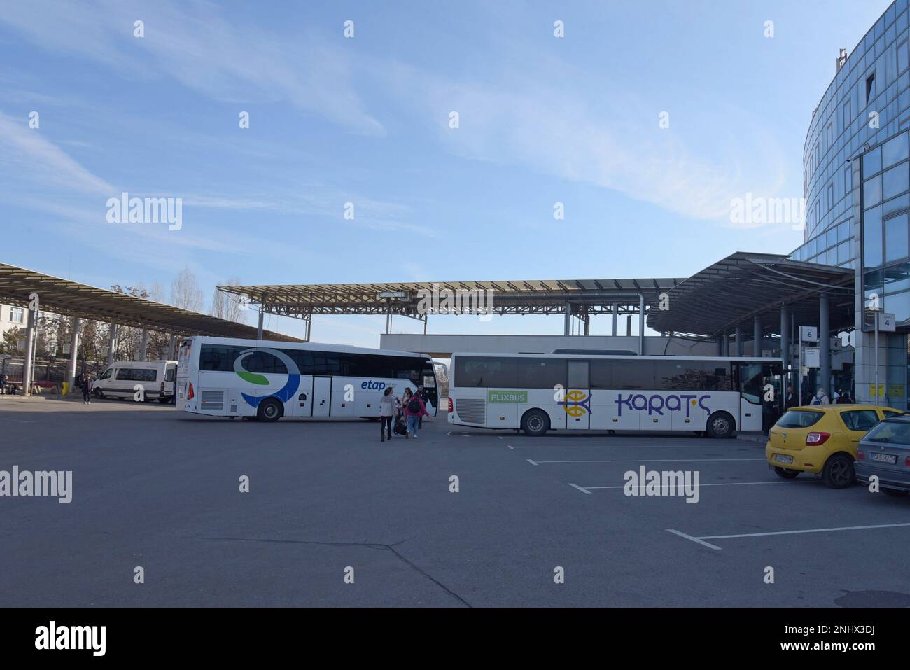 Passengers getting on long distance buses at Sofia central bus station ...