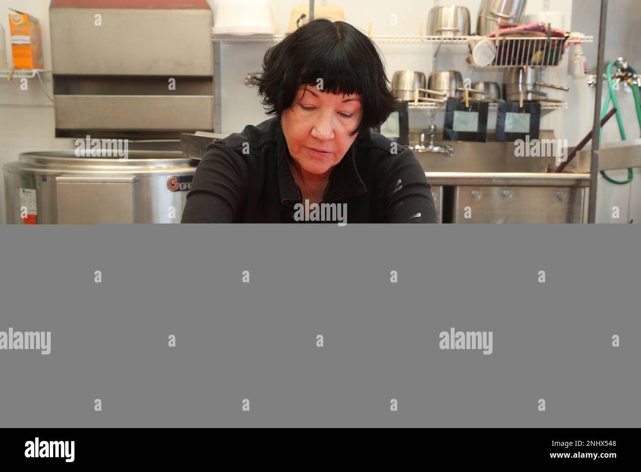 Textile painter/dyer Amy Van Every works on material for the Chinese ...