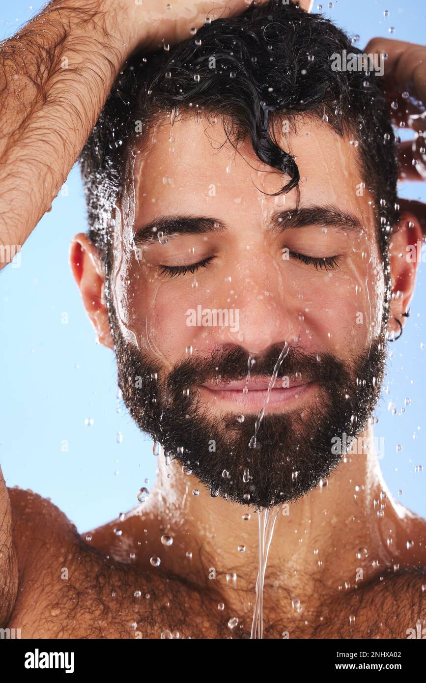 Washing, hair and man in studio for skincare, grooming and hygiene ...