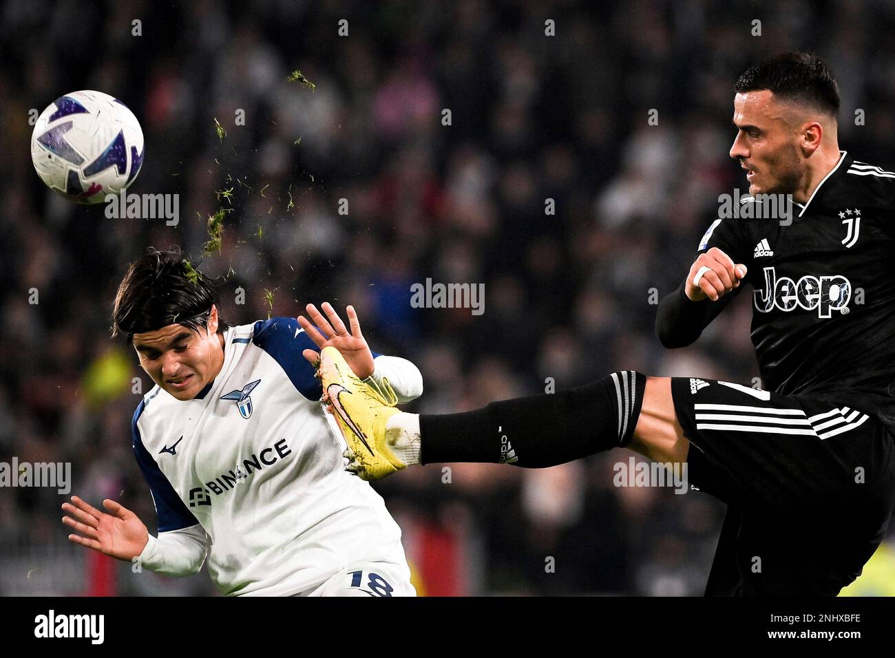 Lazio's Luka Romero, left, and Juventus Filip Kostic, right, fight for ...