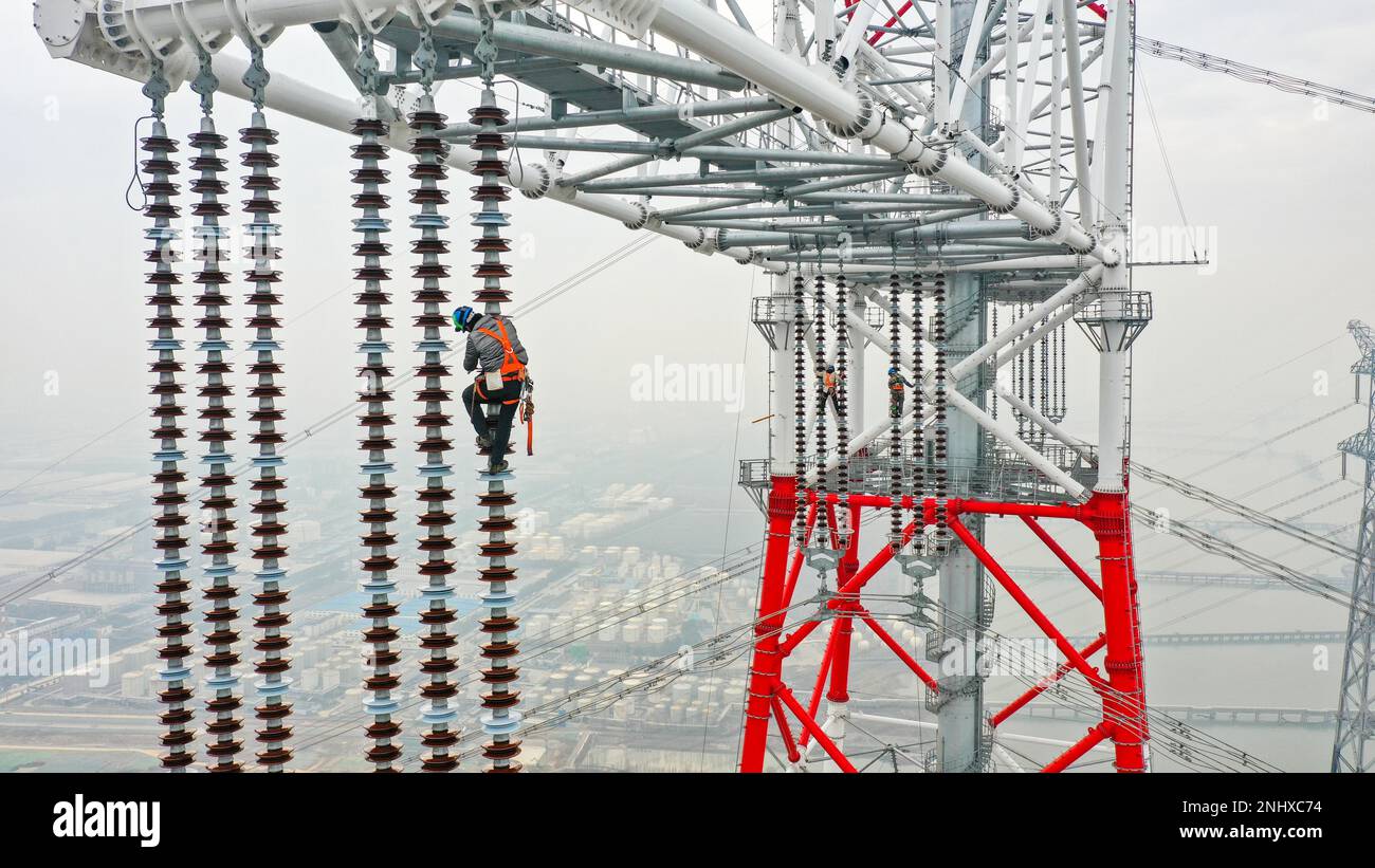 Aerial photo shows workers checking the wires of the world's highest transmission tower in Wuxi ...