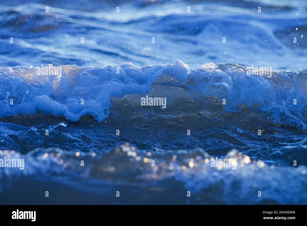 Blue ocean wave splashing on the beach. Sea wave Stock Photo - Alamy