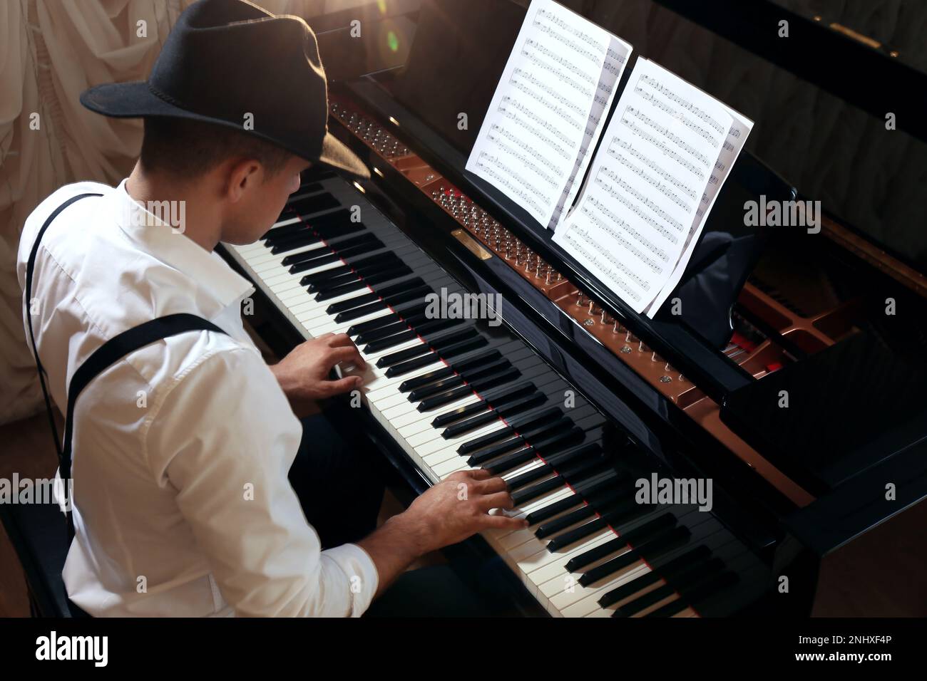 Man playing piano indoors, above view. Talented musician Stock Photo ...