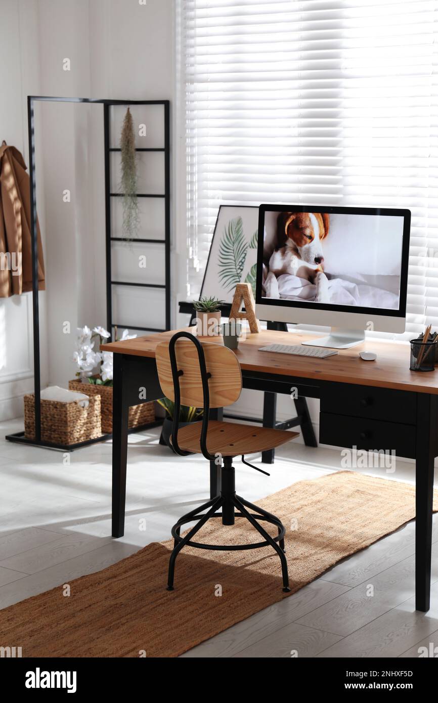 Stylish home office interior with comfortable workplace Stock Photo - Alamy