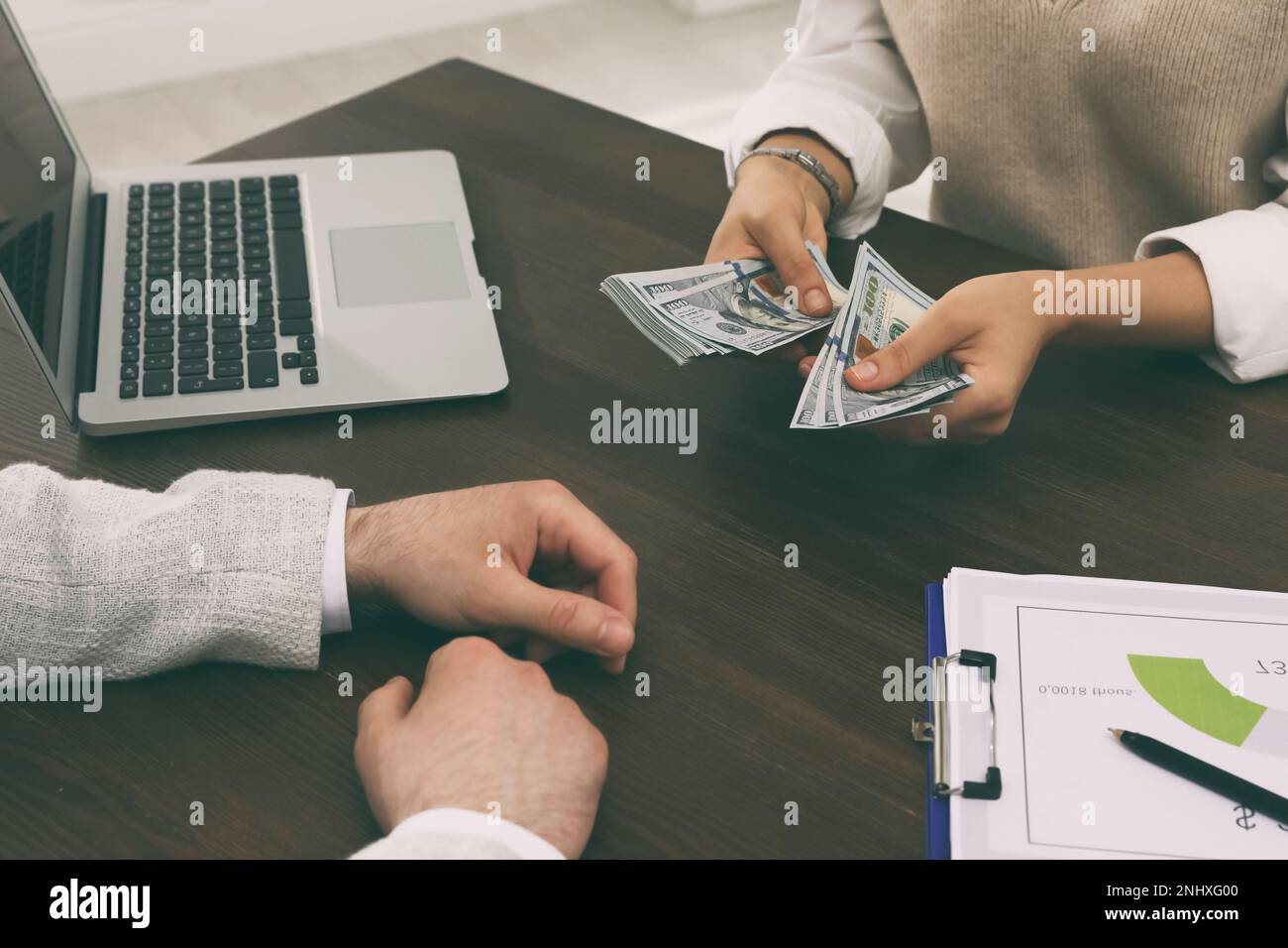 Cashier giving money to businessman at desk in bank, closeup Stock ...