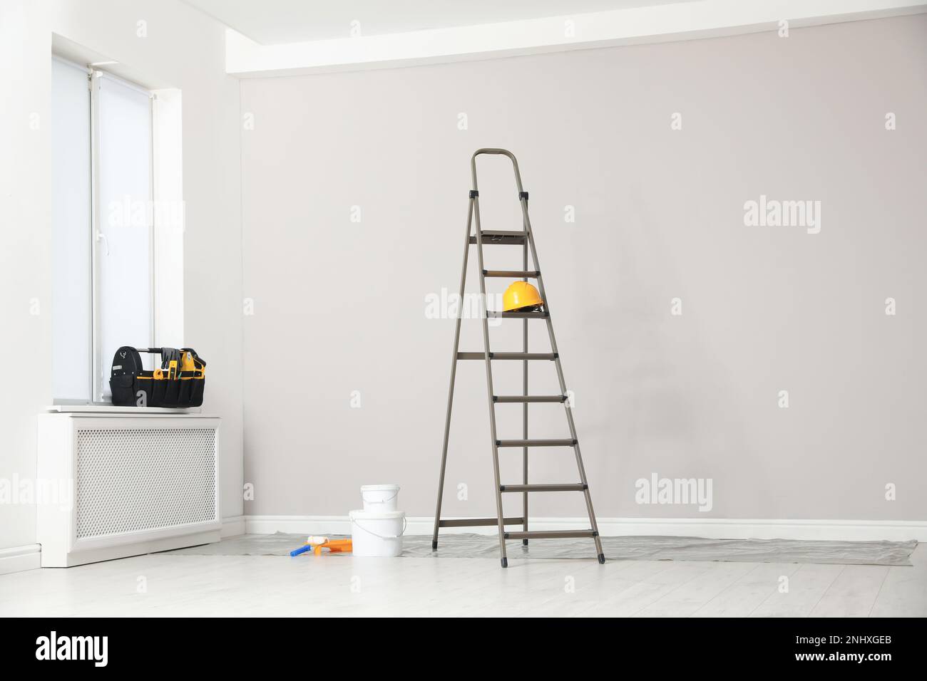 Ladder, decorator's tools and box with instruments in room Stock Photo ...