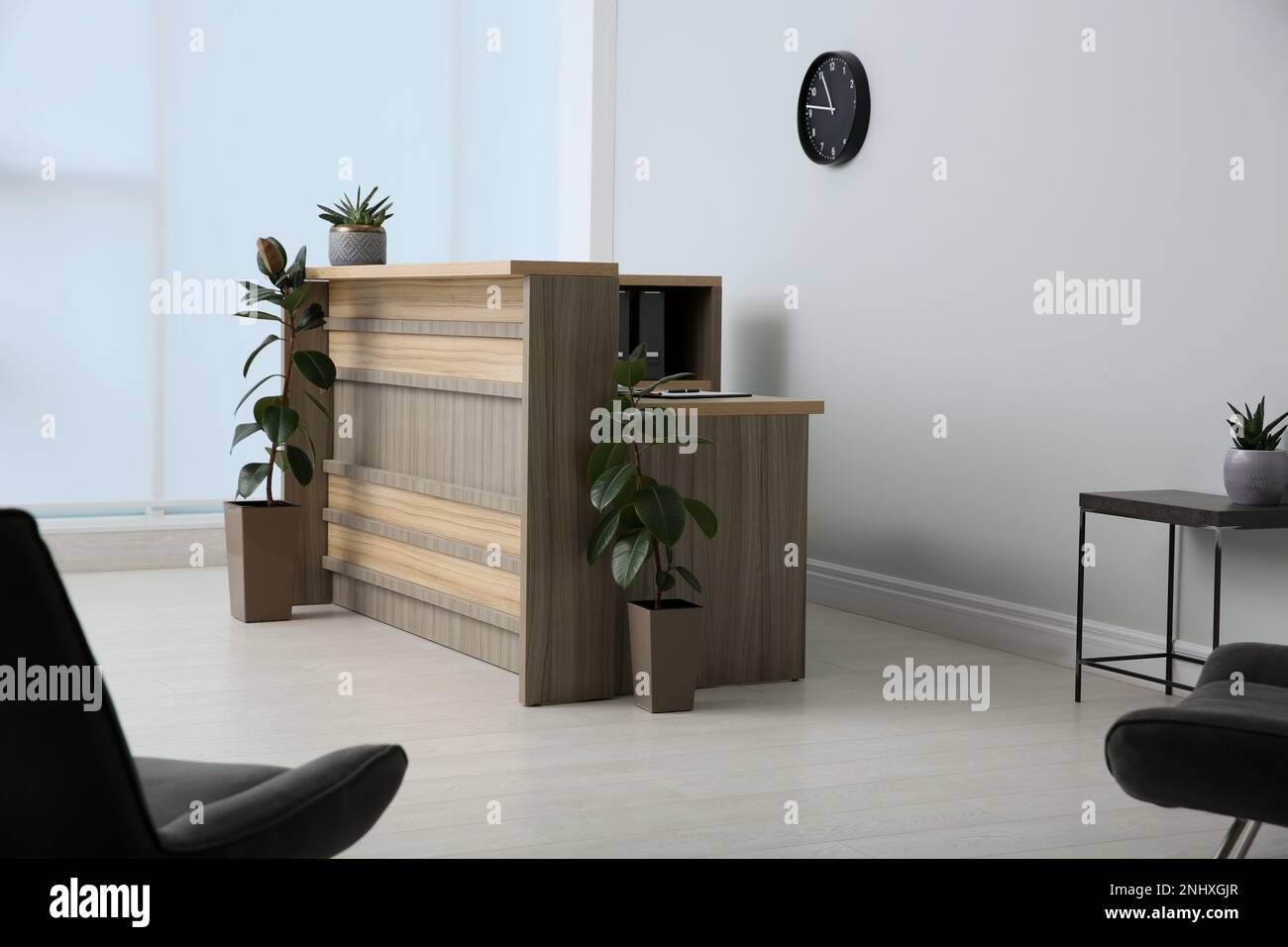 Lobby interior with stylish wooden receptionist desk Stock Photo - Alamy