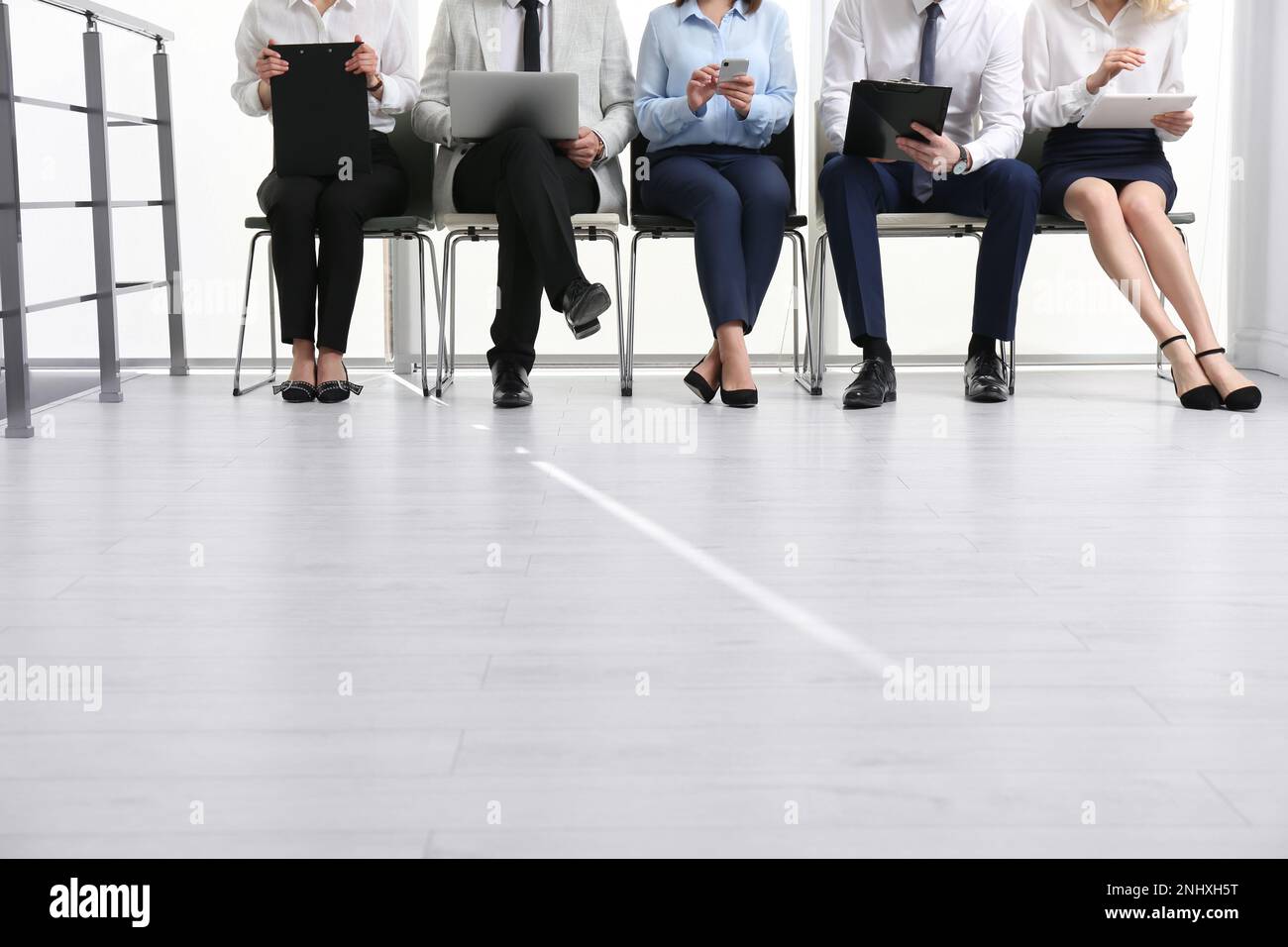 People waiting for job interview in office hall, closeup Stock Photo ...