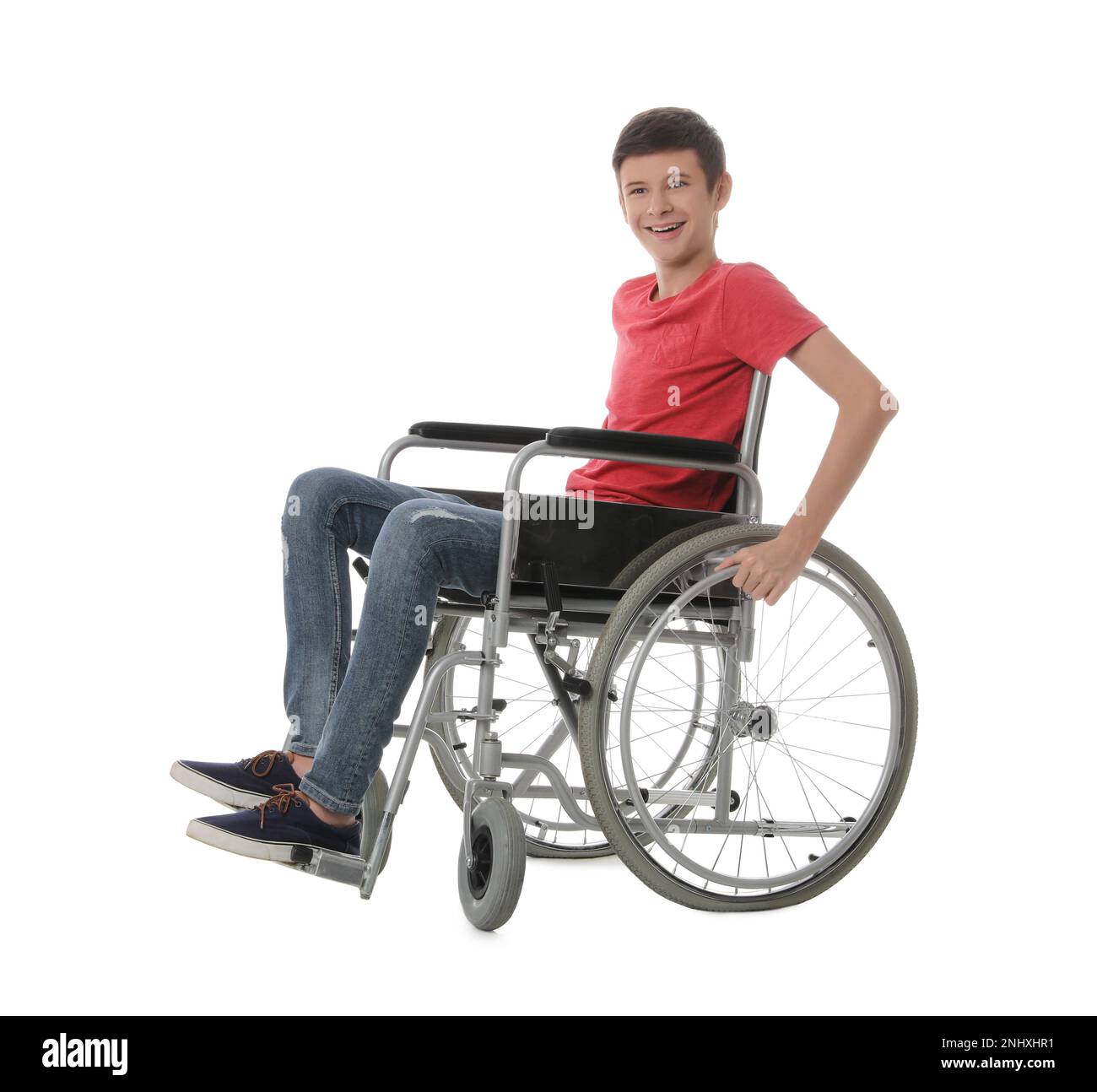 Teen boy in wheelchair on white background Stock Photo - Alamy