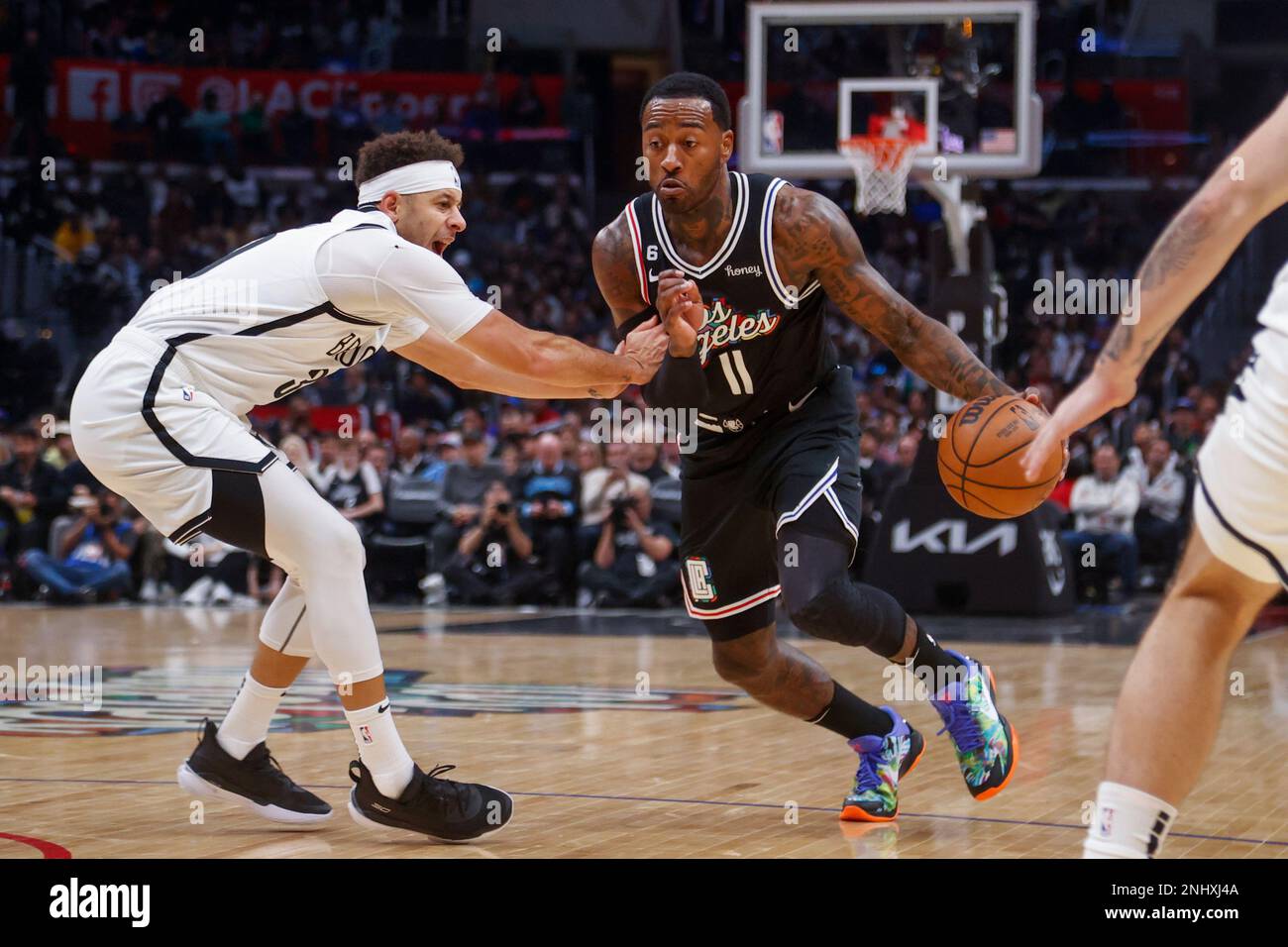 Los Angeles Clippers guard John Wall (11) drives past Brooklyn Nets ...