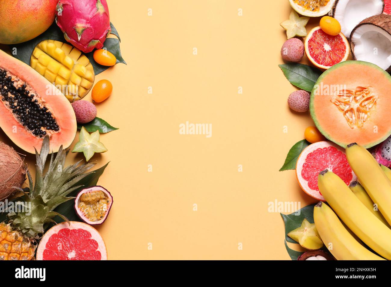 Different exotic fruits on beige background, flat lay. Space for text ...