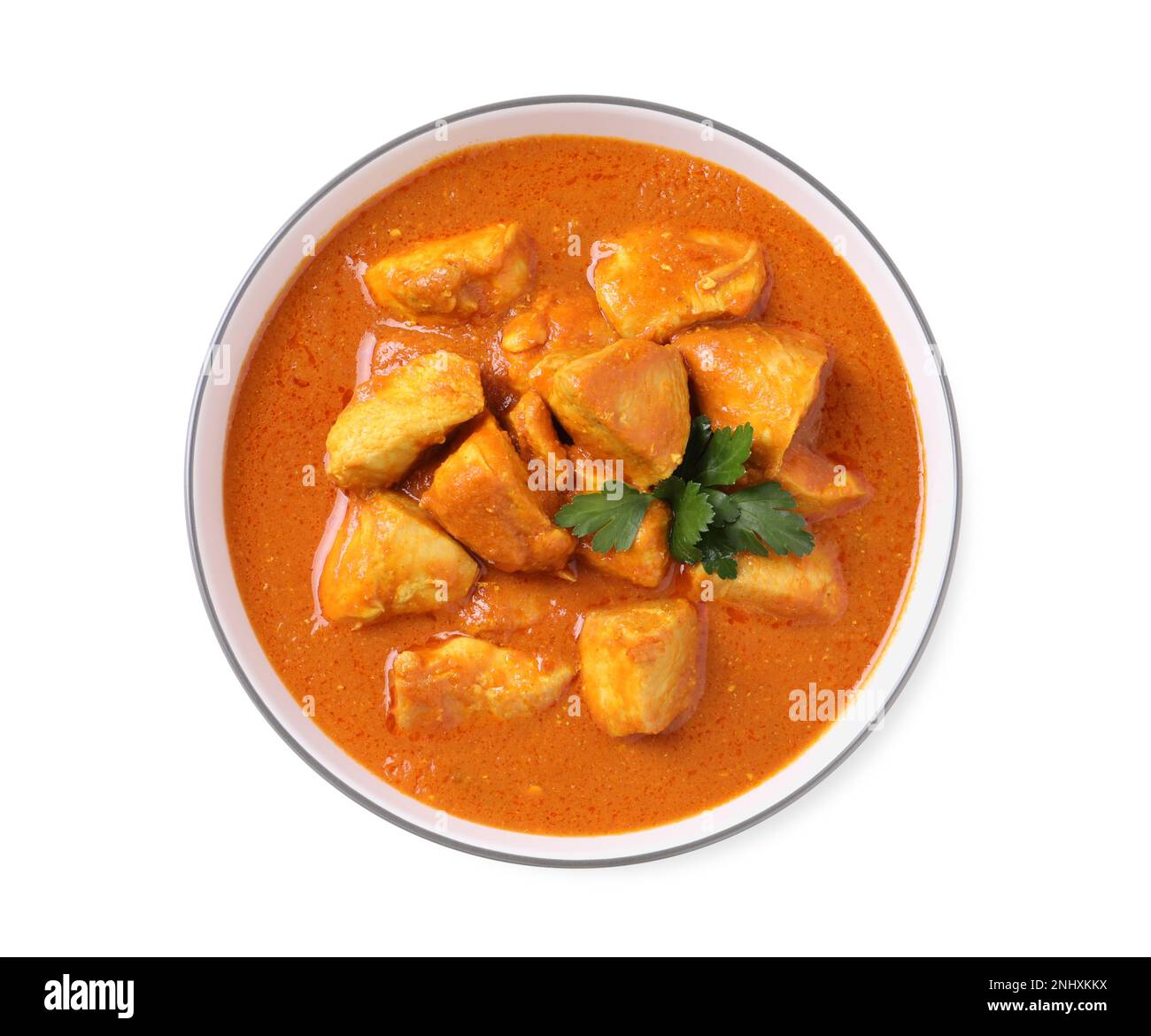 Bowl of delicious chicken curry on white background, top view Stock ...