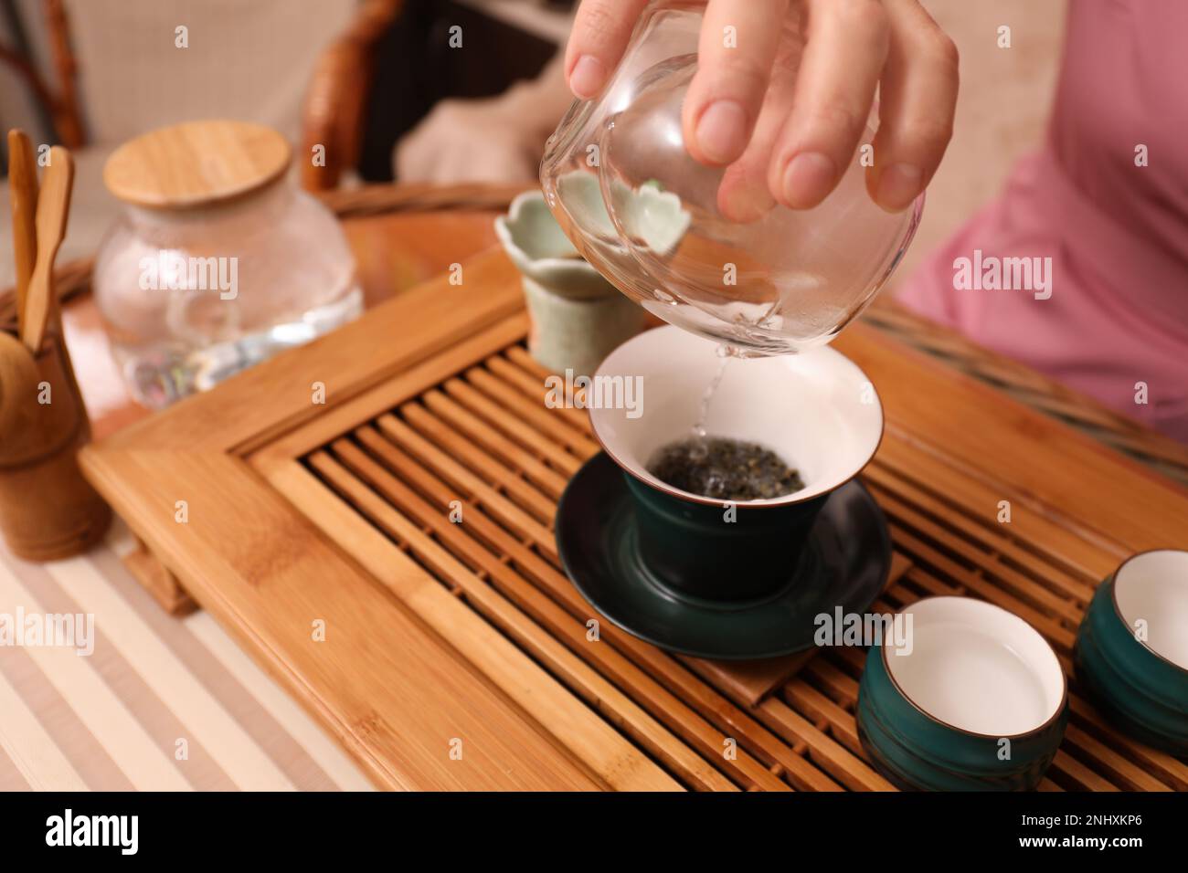 Master conducting traditional tea ceremony at table, closeup Stock ...