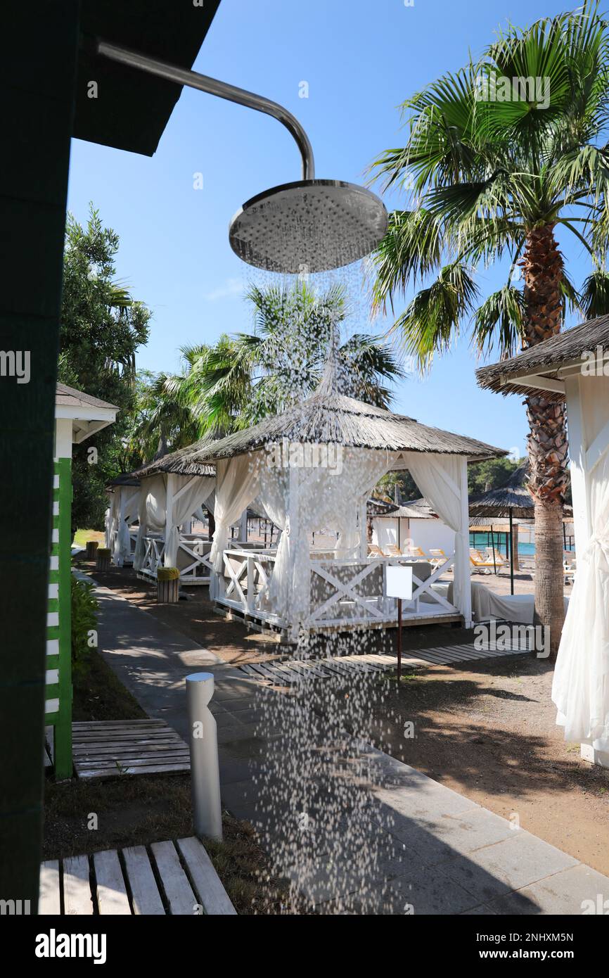 Outdoor shower with running water on beach at resort Stock Photo - Alamy