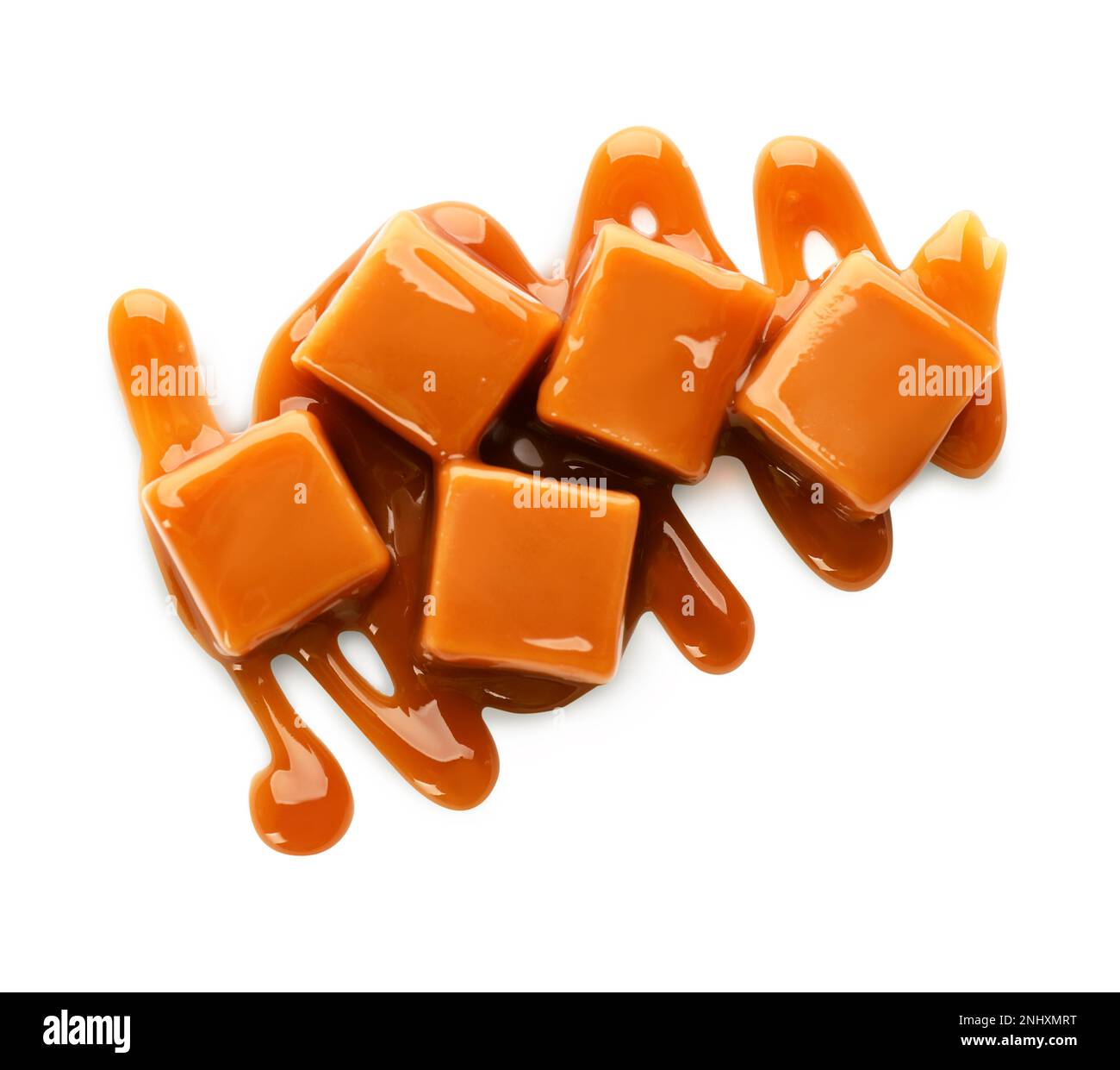 Caramel candies with topping on white background, top view Stock Photo ...