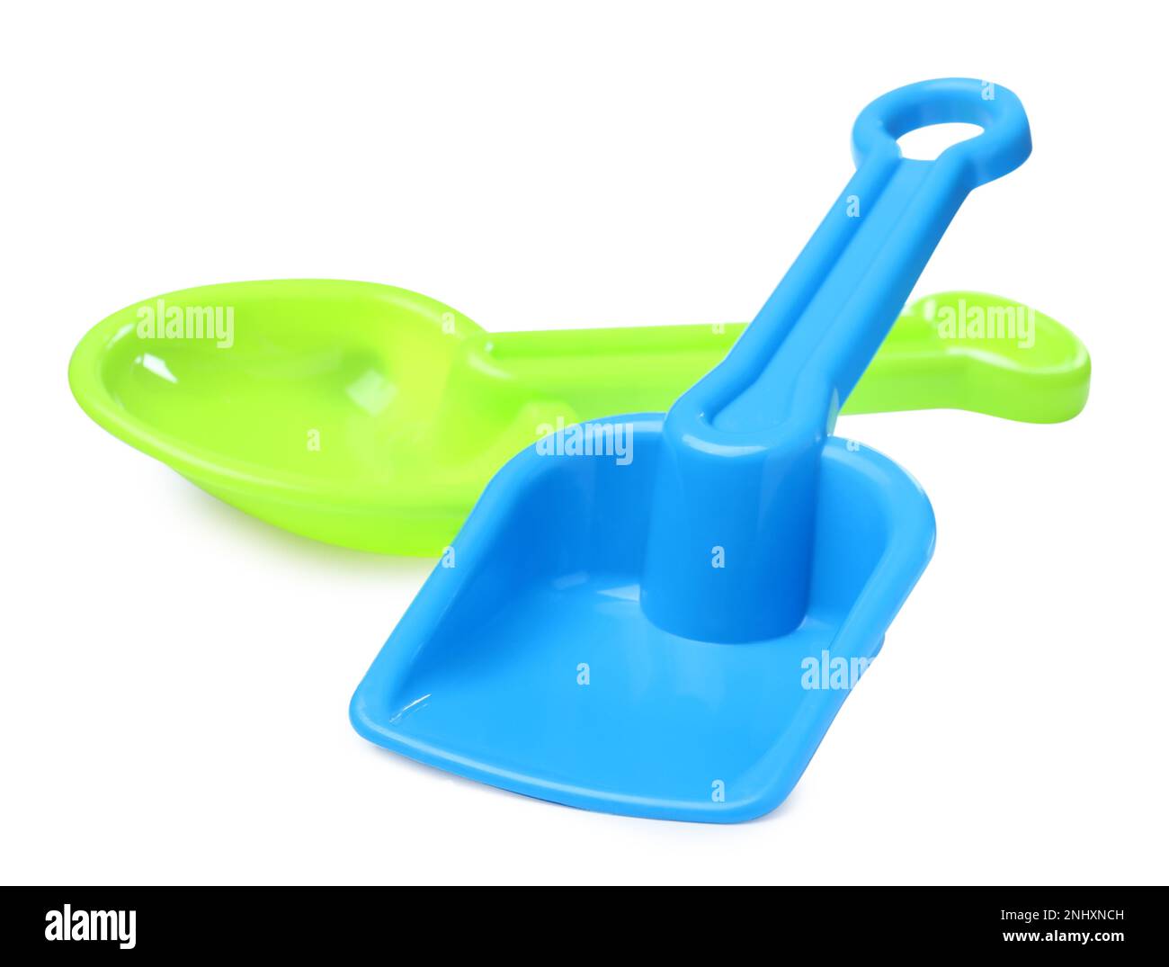 Green and light blue plastic toy shovels on white background Stock ...