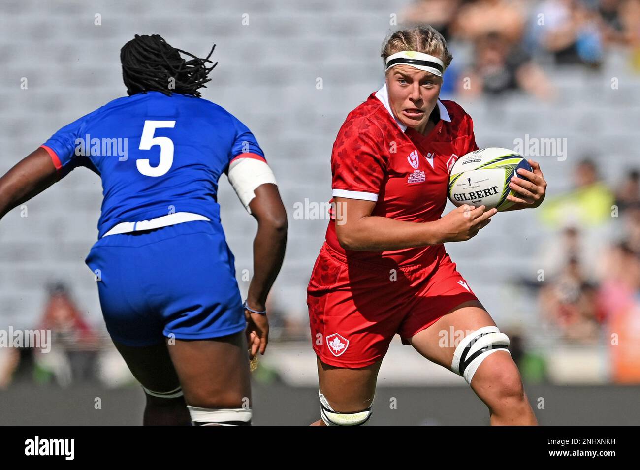 Canada's Courtney Holtkamp, right, rushes toward France's Madoussou ...