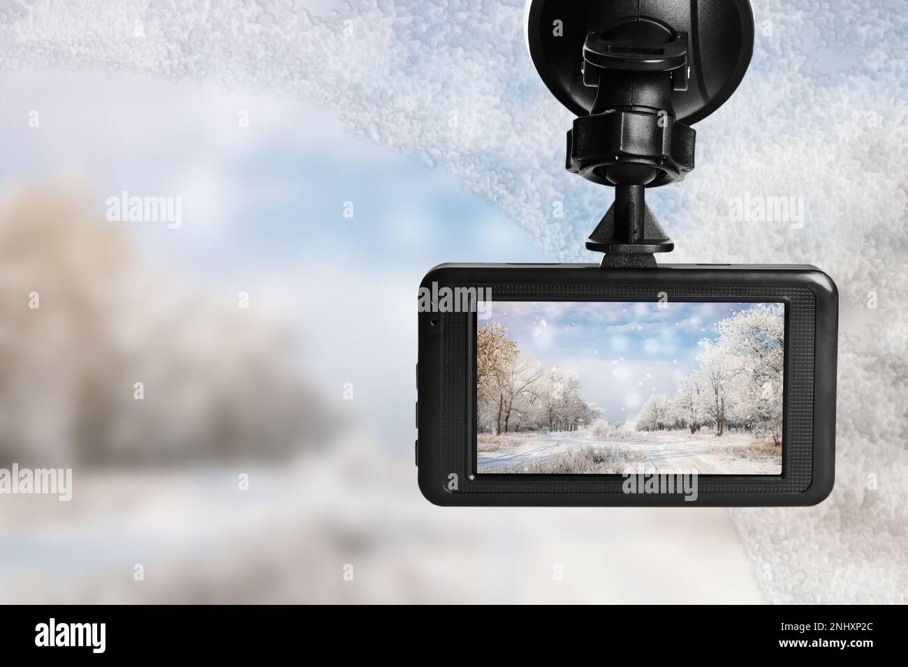 Modern dashboard camera mounted in car, view of road during driving ...