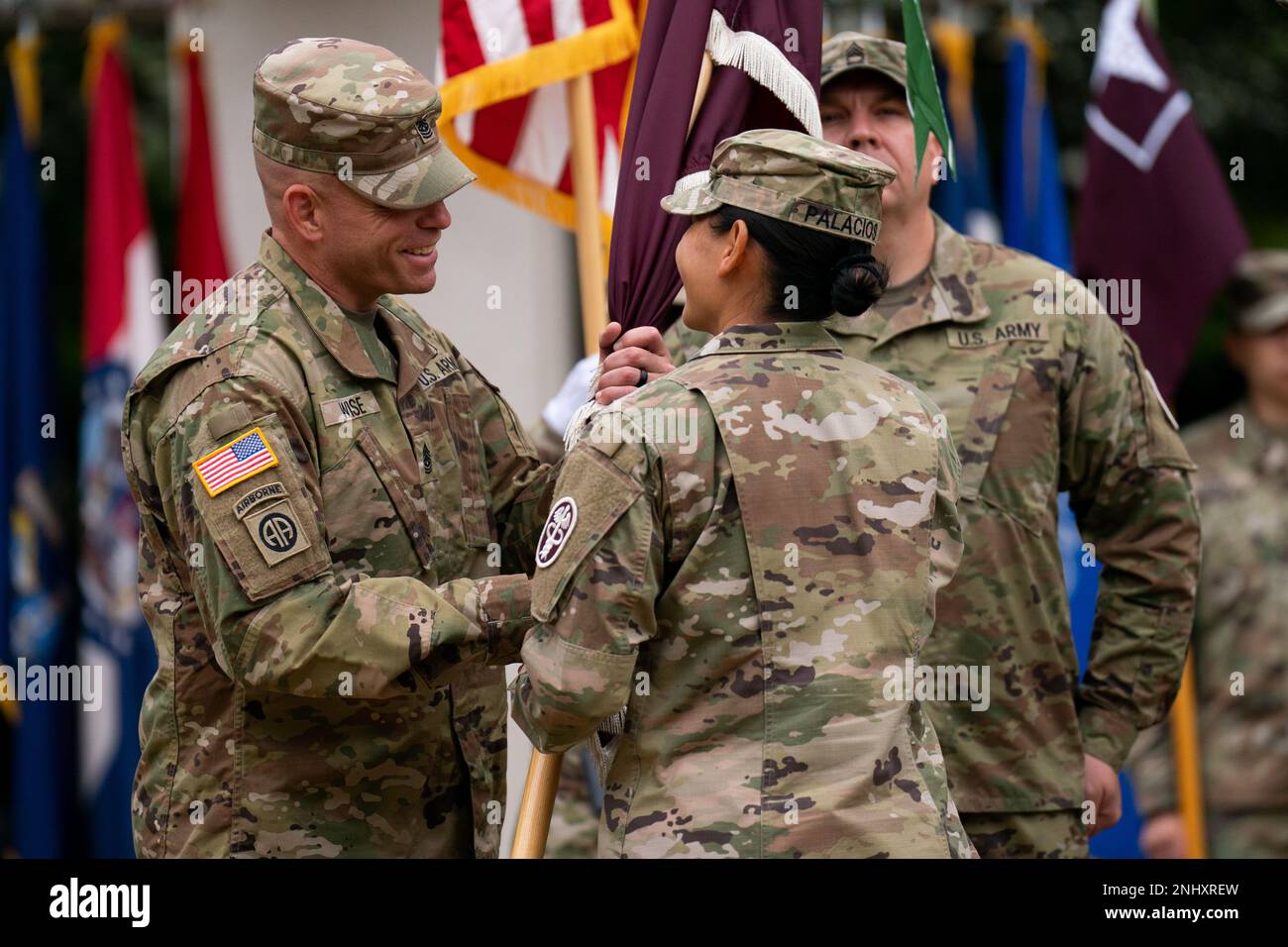 Command Sgt. Maj. Blake Wise accepts the colors for Troop Battalion at ...