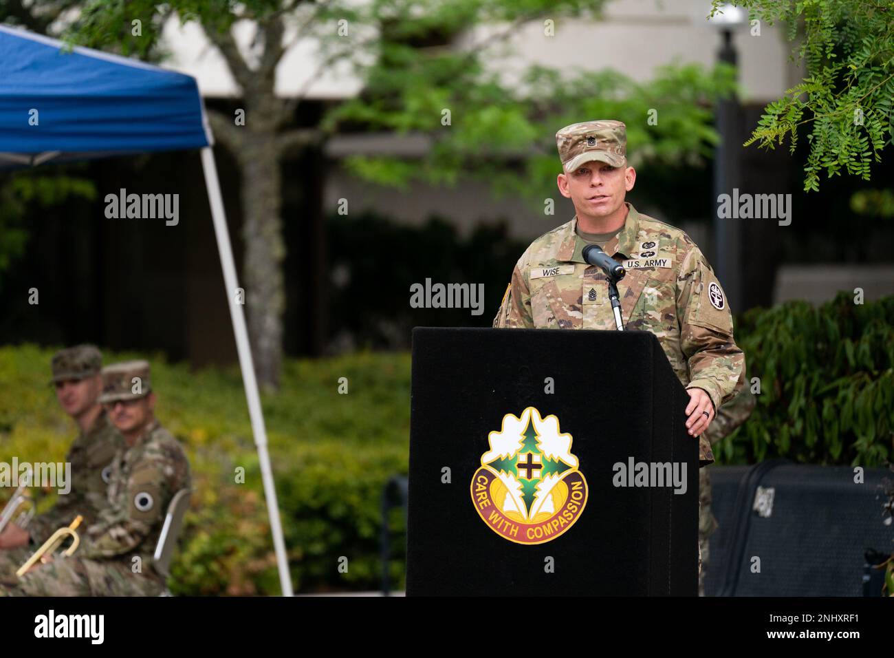 Command Sgt. Maj. Blake Wise offers introductory words as he accepts ...