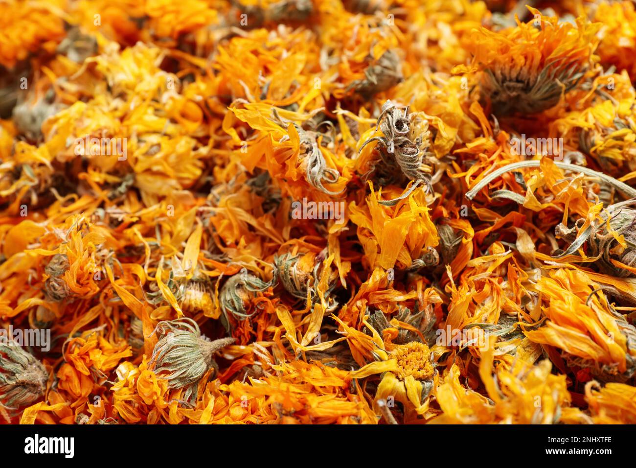 Pile of dry calendula flowers as background, closeup Stock Photo - Alamy
