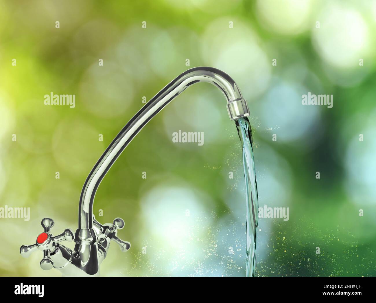 Water flowing from tap outdoors on sunny day, bokeh effect Stock Photo ...