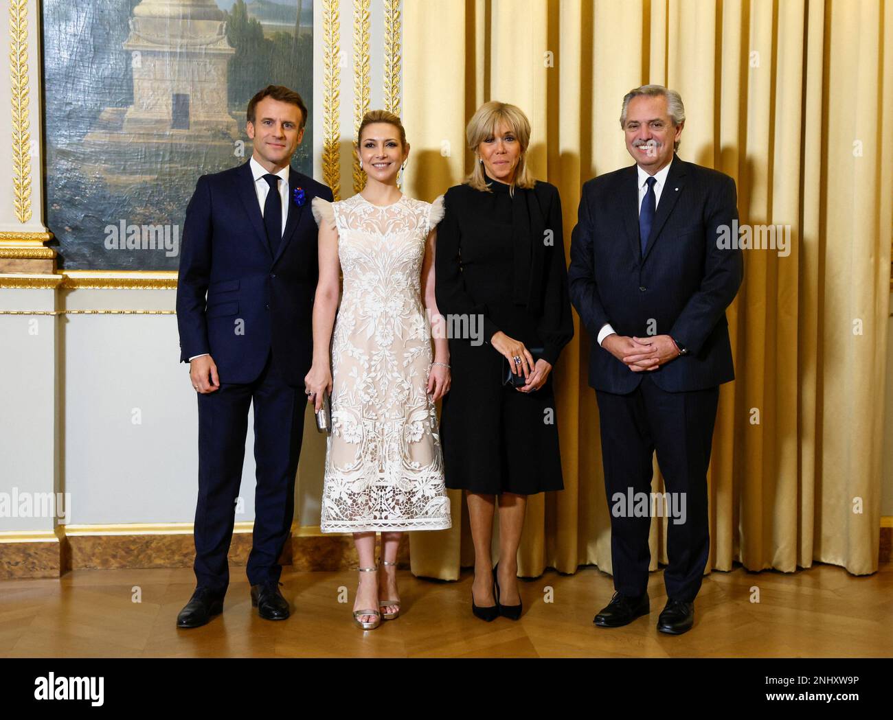 French President Emmanuel Macron, left, poses with his wife Brigitte ...