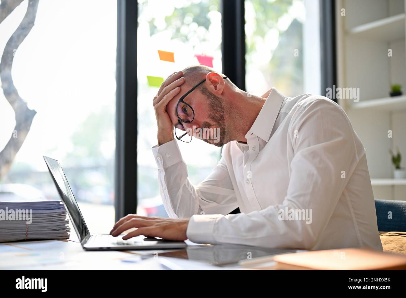 Stressed and unhappy caucasian businessman or male financial consultant ...