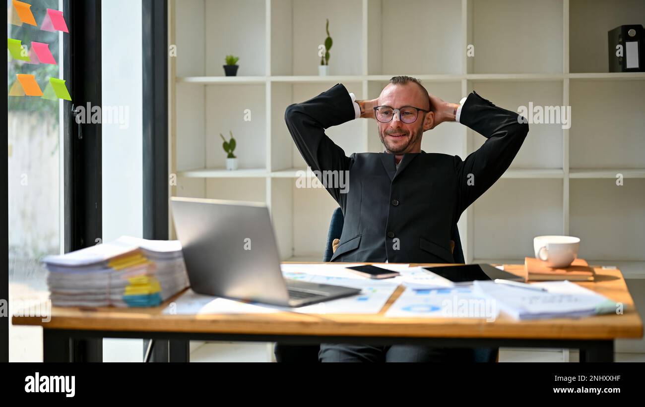 Boss working behind desk hi-res stock photography and images - Alamy