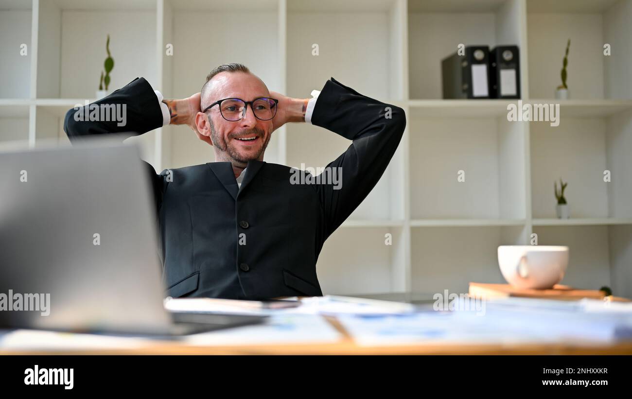 Boss sitting behind desk hi-res stock photography and images - Alamy