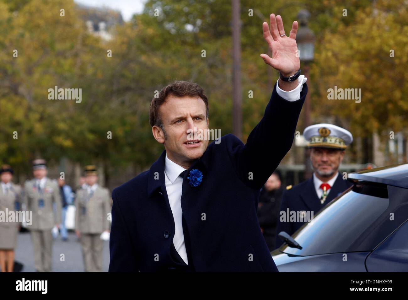 French President Emmanuel Macron waves as he attends a ceremony at the ...