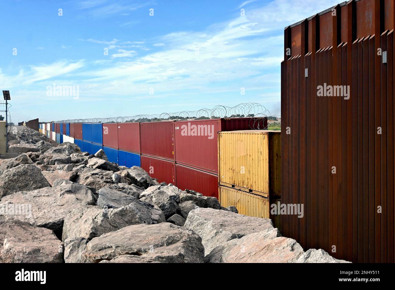 A wall which was built during the Trump administration (front) and ...