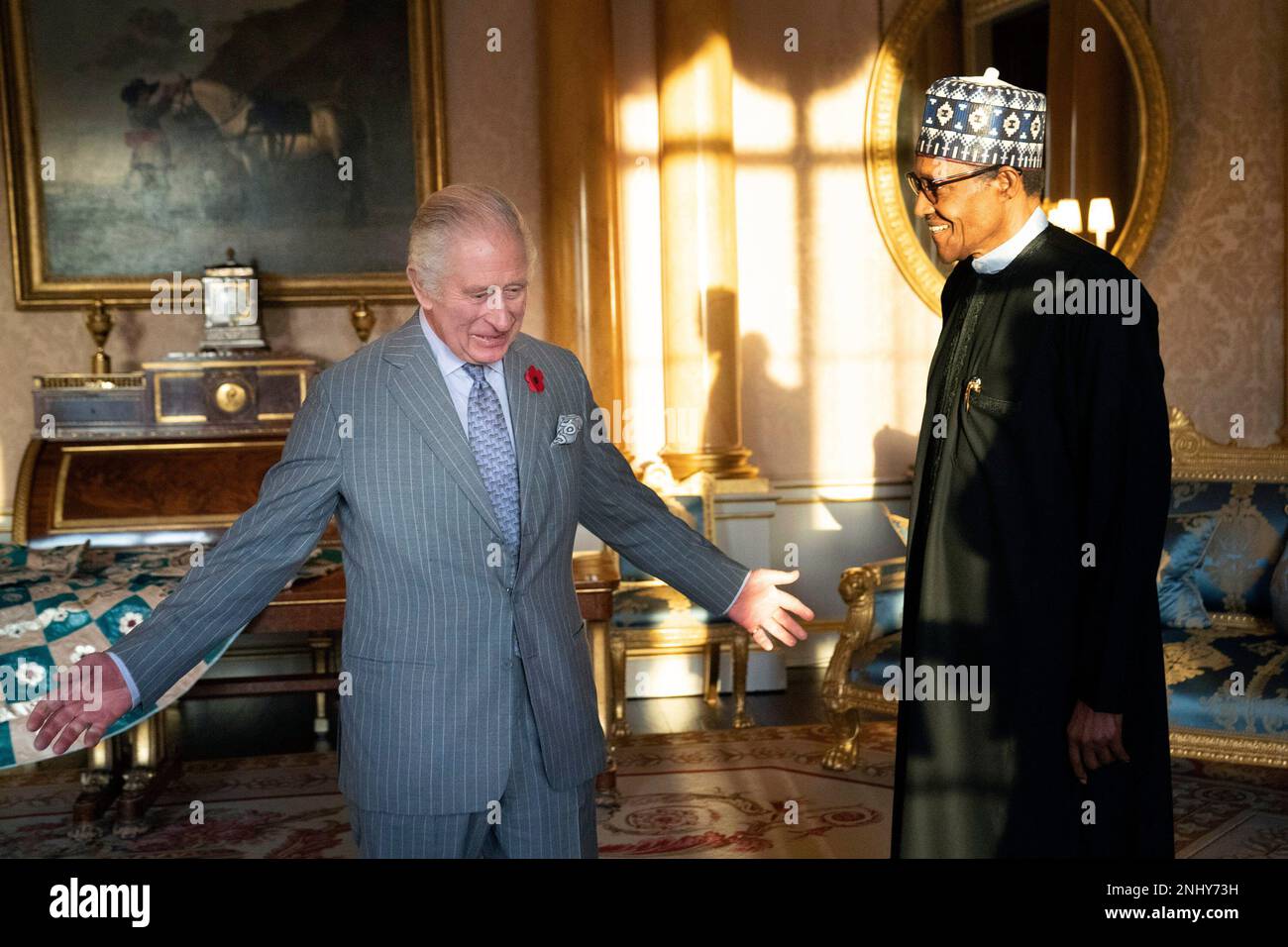 Britain's King Charles III, left, reacts with the President of Nigeria ...