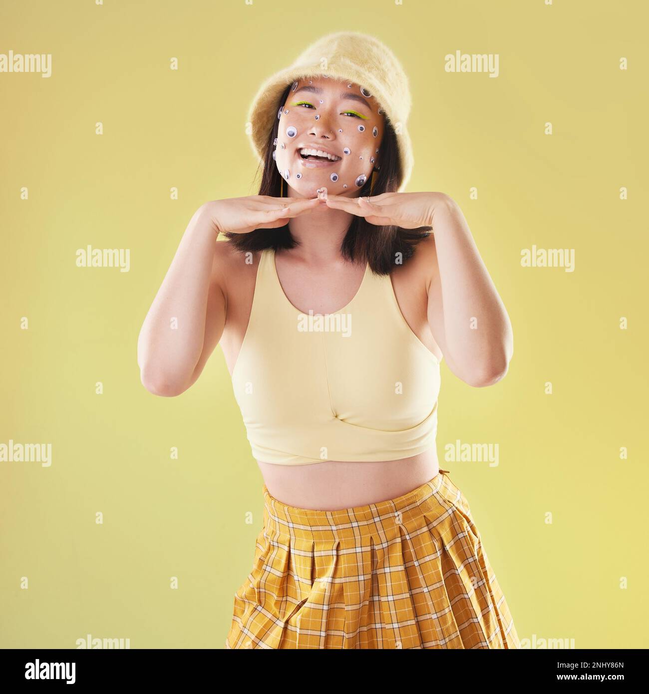 Fashion, hands on face and portrait of woman with comic eyes isolated ...