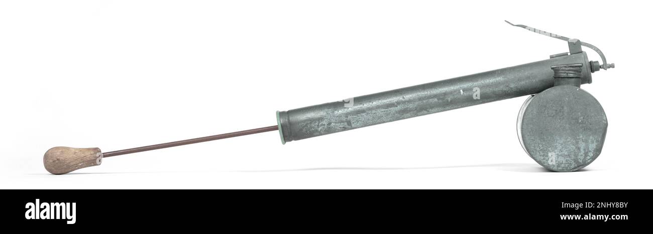 Old brass insecticide spray on a white background Stock Photo - Alamy