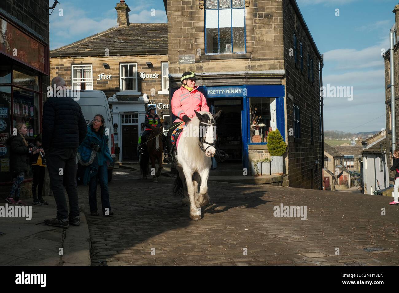 Haworth, West Yorkshire, UK. Riding Horses through Haworth. Haworth is ...