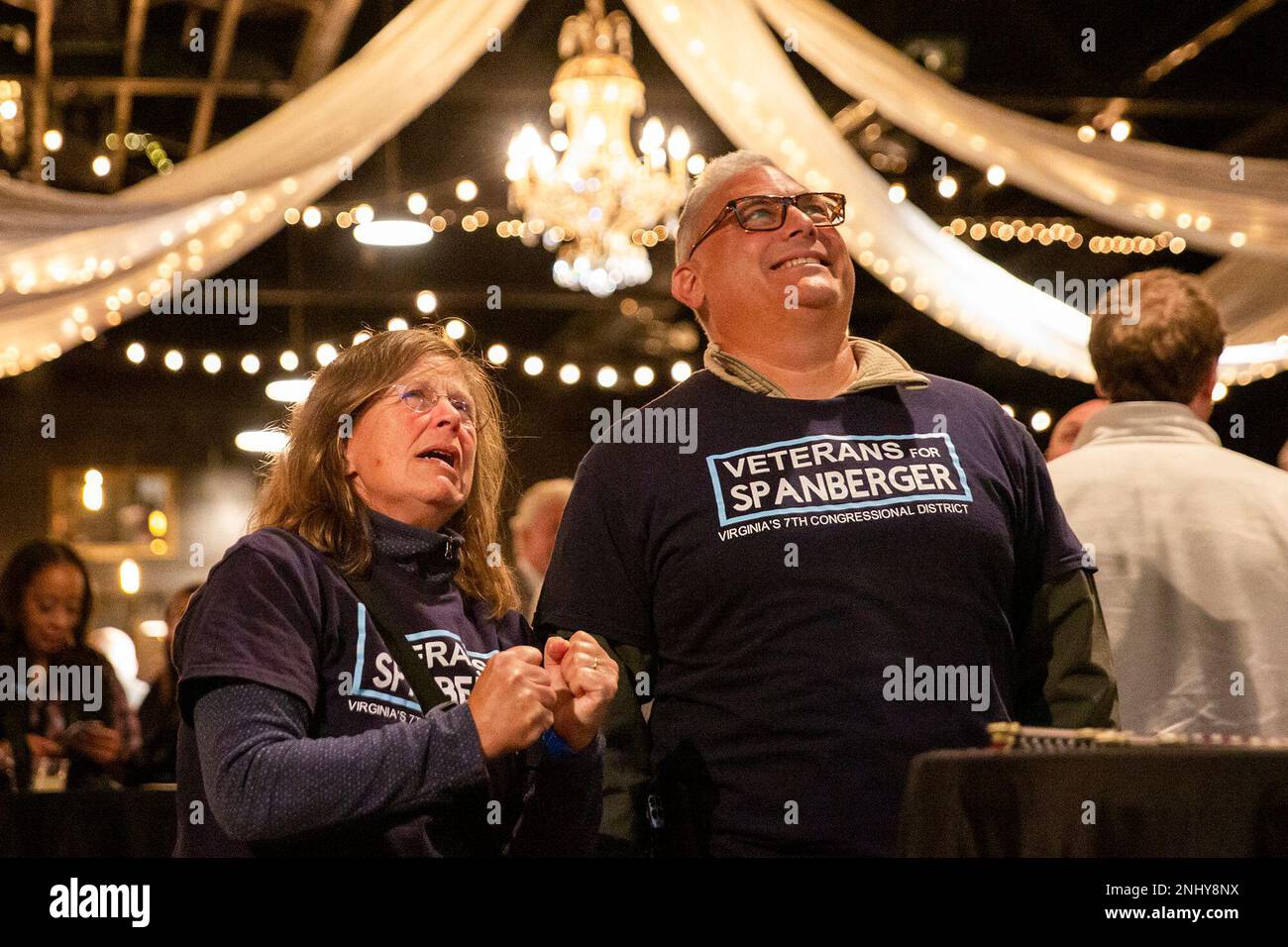 Caitlin Goodale-Porter, left, and her husband, Daniel, react as they ...