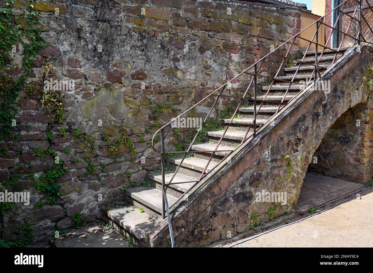 Stairs on an old stone wall of a castle in sunlight Stock Photo - Alamy