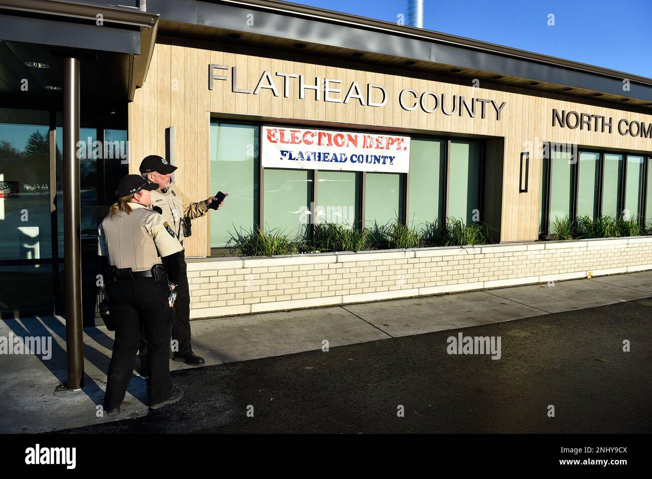 Two Flathead County Sheriff's Office reserve officers talk outside the ...