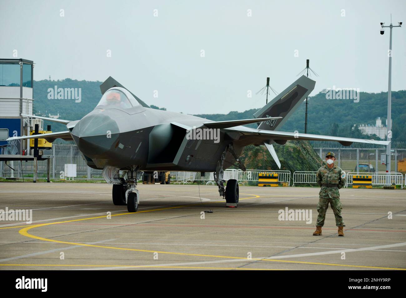 A PLA J-20 stealth fighter stands on the tarmac in its first static display for the public at ...