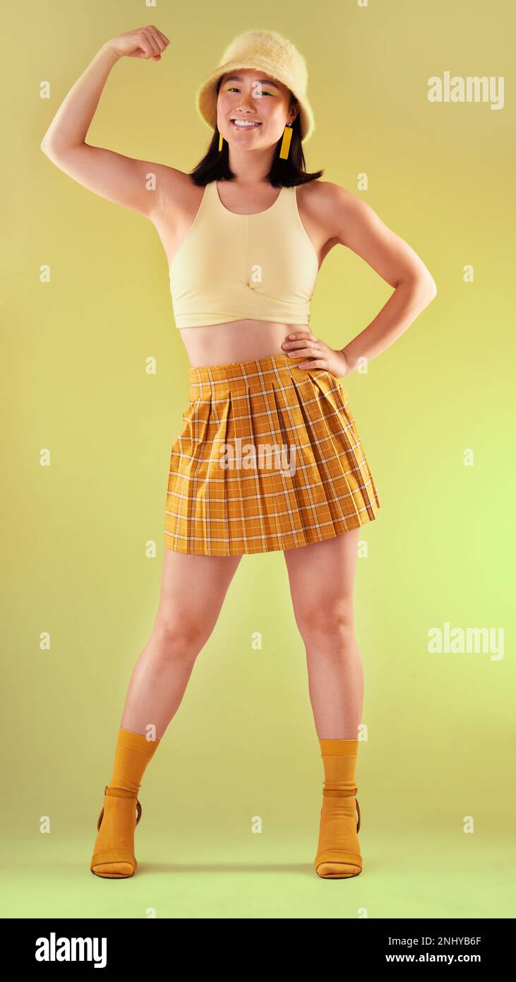Smile, power and asian woman flexing arm, full body portrait of gen z ...