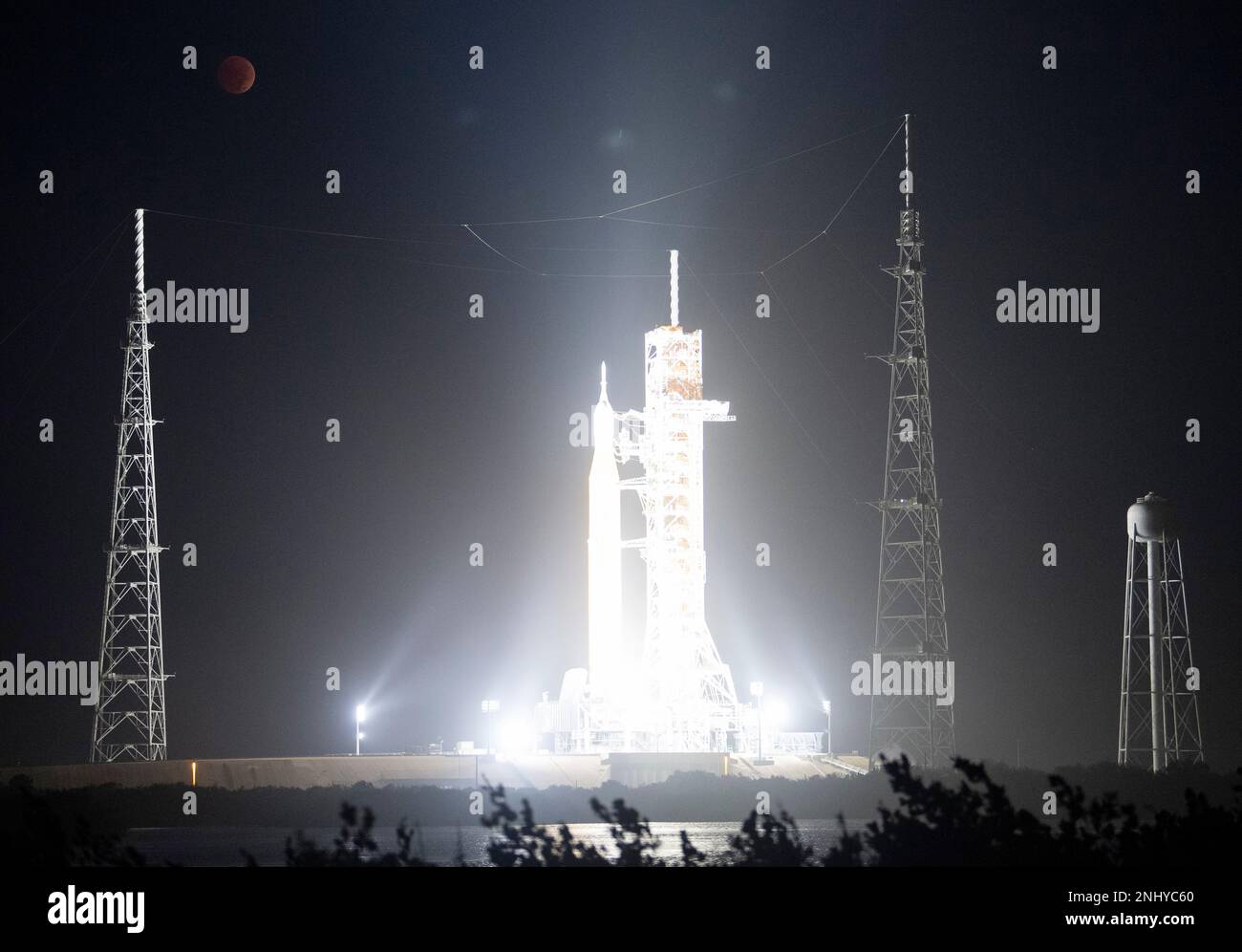 The moon is seen during a total lunar eclipse above NASA's Space Launch ...