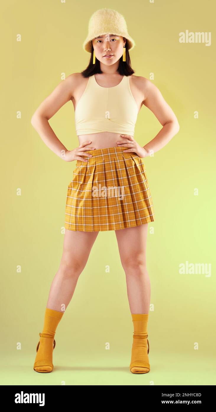 Fashion, gen z and Asian woman in yellow, beauty and streetwear with ...