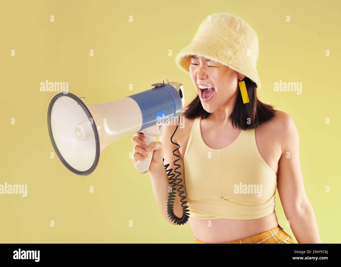 Asian, girl and studio with megaphone for protest, shout and speech for ...
