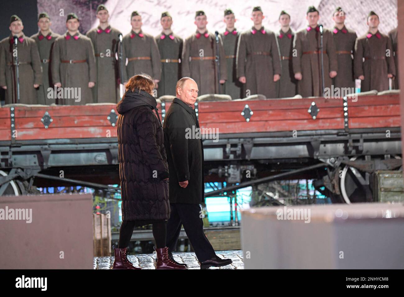 Russian President Vladimir Putin walks as participants dressed in Red ...