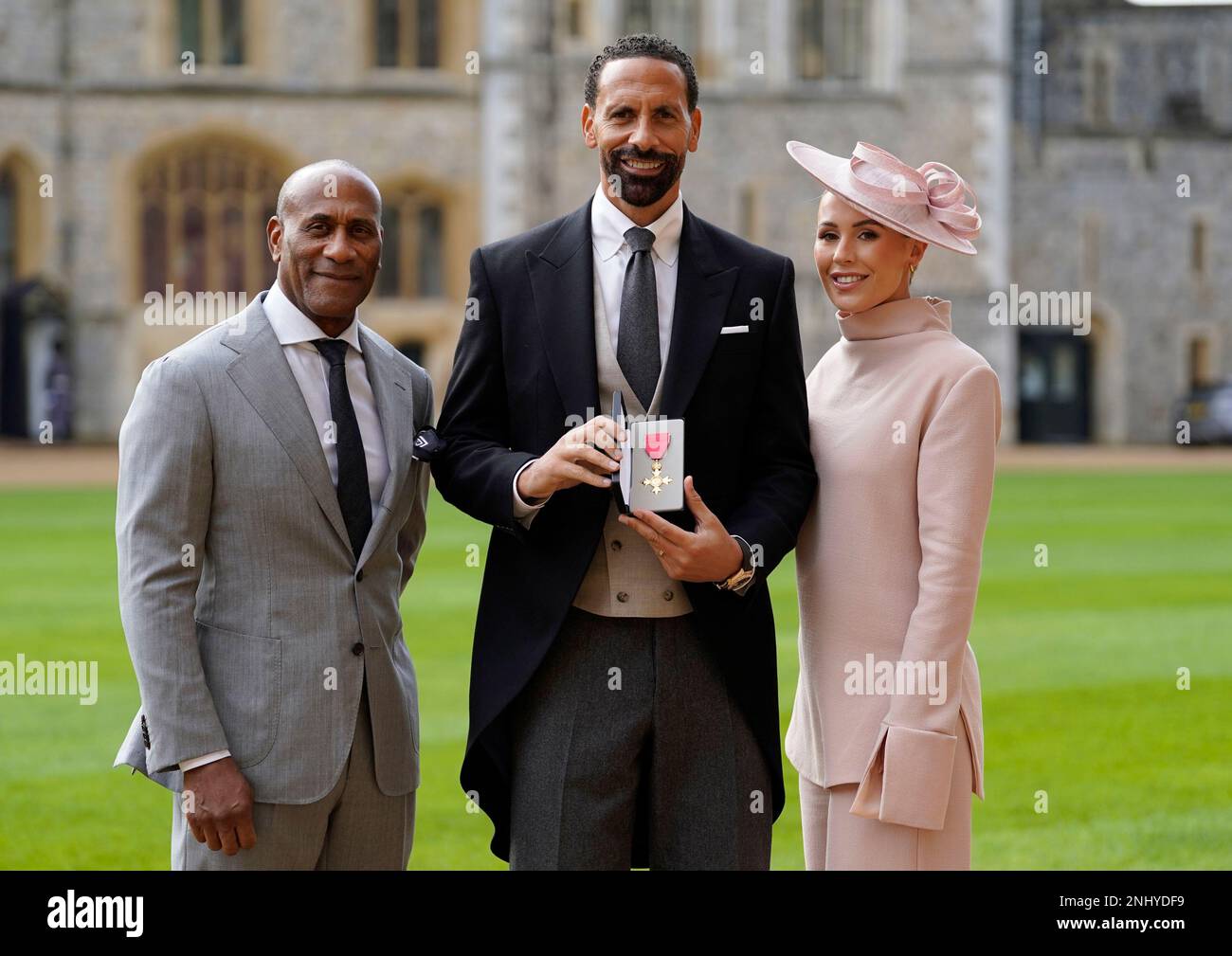 Former soccer player Rio Ferdinand, centre, poses with his wife Kate Ferdinand and his father ...