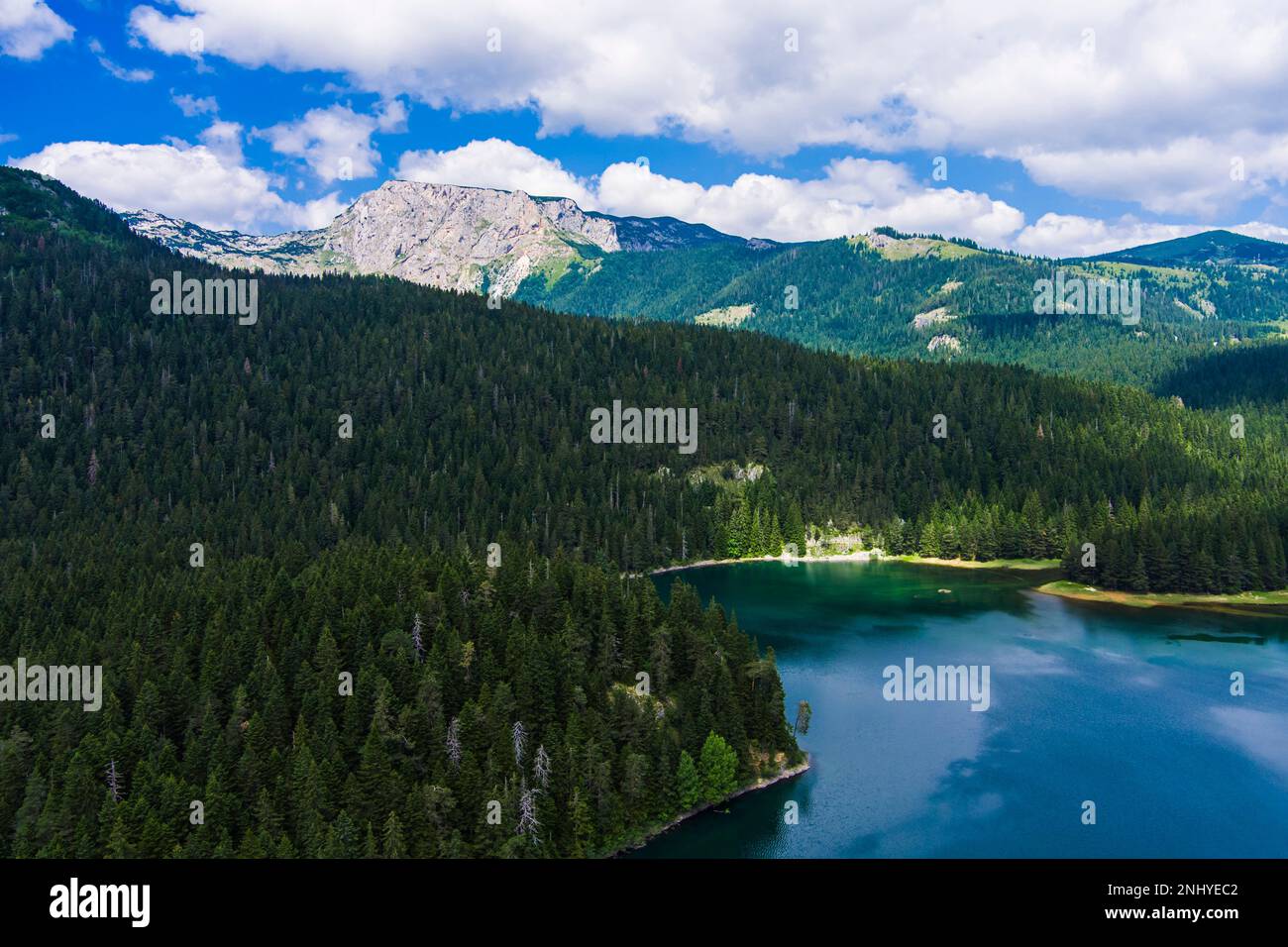 Montenegro. Durmitor National Park. Black lake surrounded by green ...