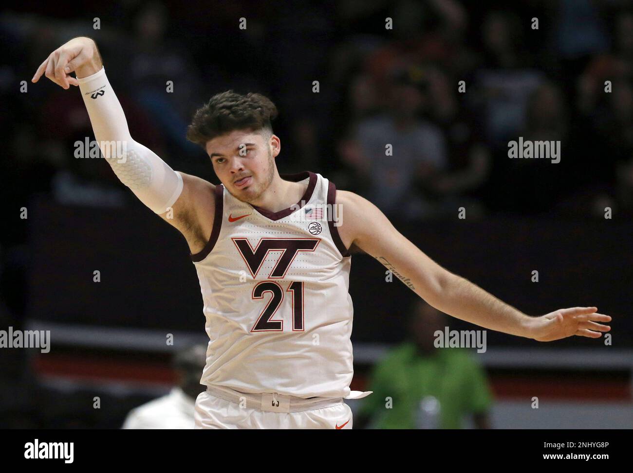Virginia Tech's Grant Basile (21) celebrates making a 3-point basket in ...
