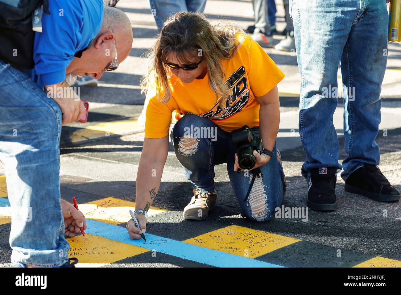 AVONDALE, AZ - NOVEMBER 06: A fan signs the start finish line before ...